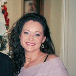 Butterfly with torn wings on hand indoors | ID: 70261520